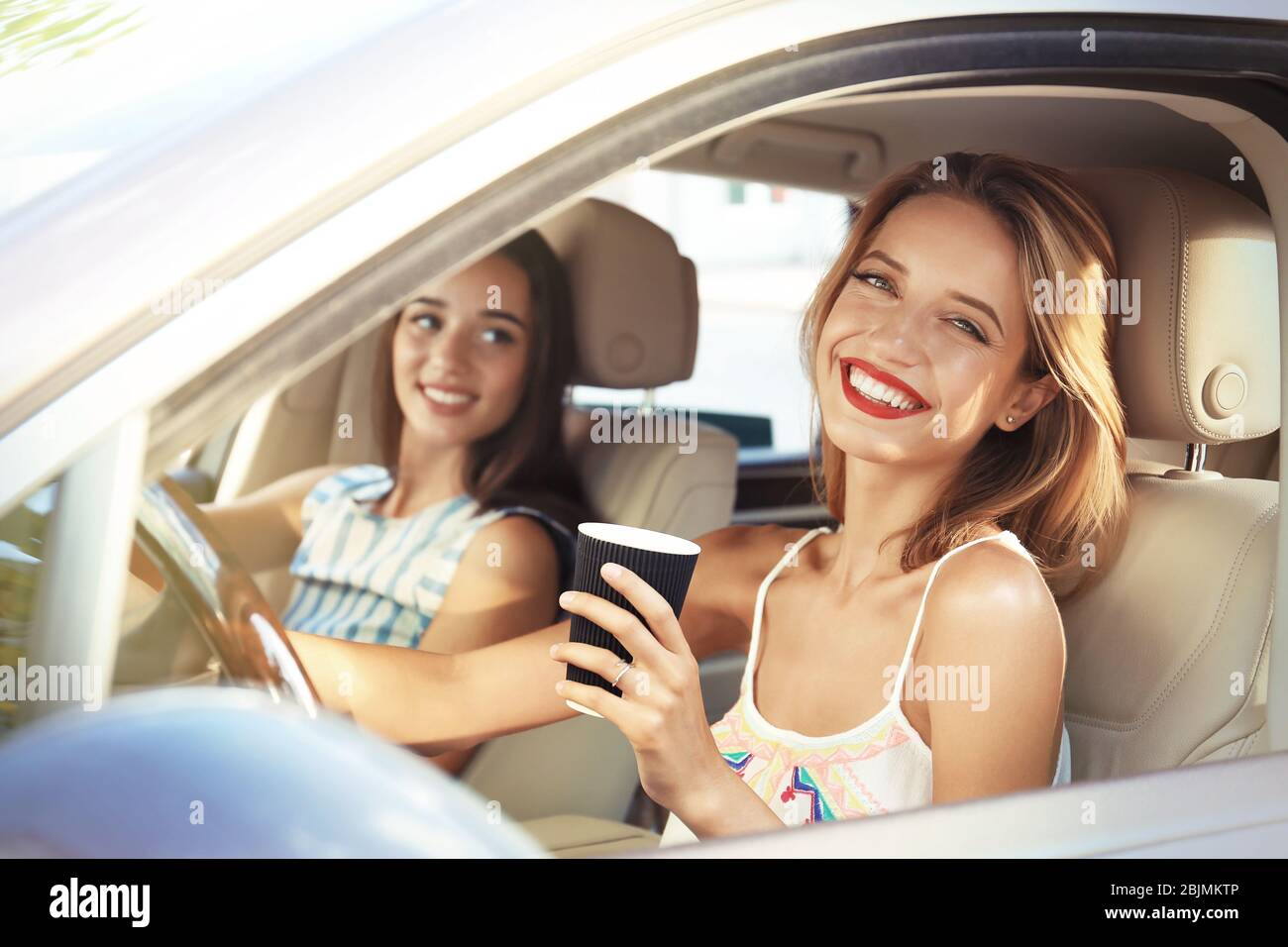 Beautiful young women in car Stock Photo - Alamy