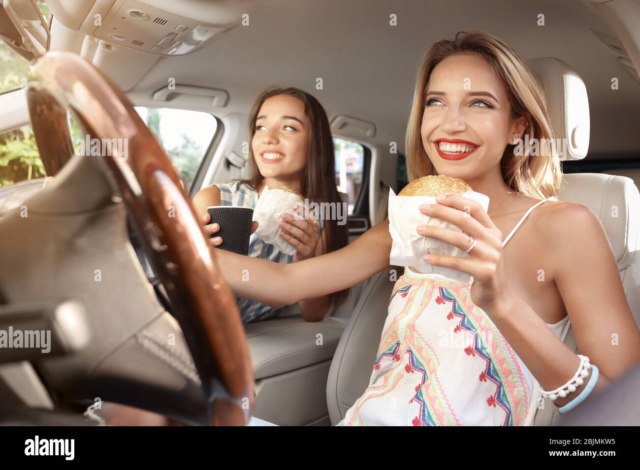 Beautiful young women in car Stock Photo - Alamy