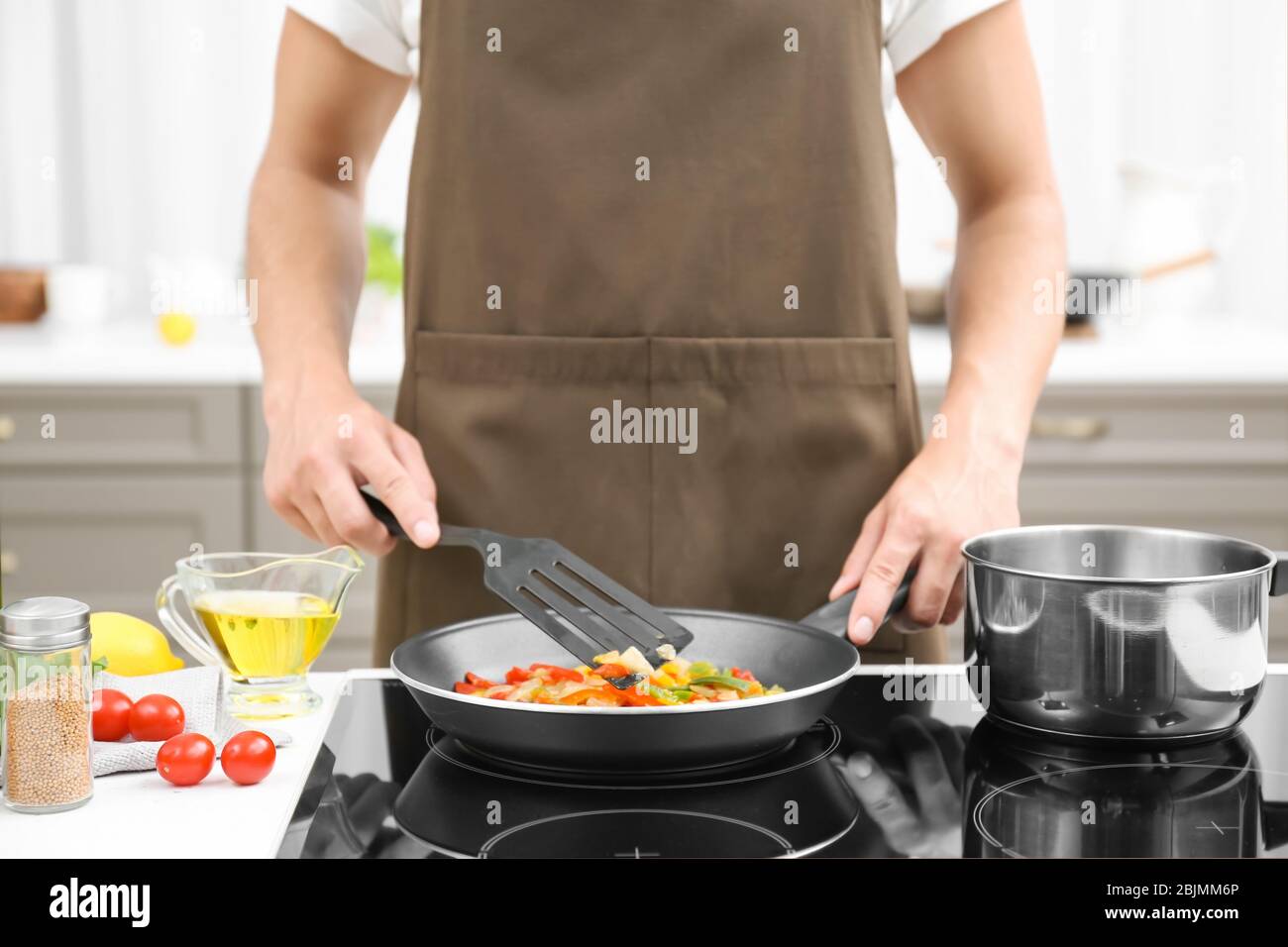 Vegetables oil man eating not woman hi-res stock photography and images ...