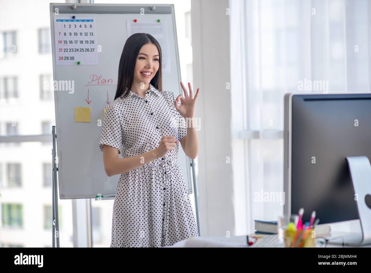 Young sign language interpreter conducting a webinar for deaf people ...