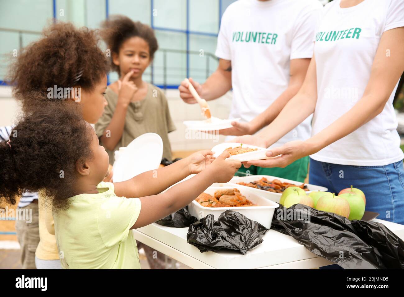 Children Sharing Food To The Poor