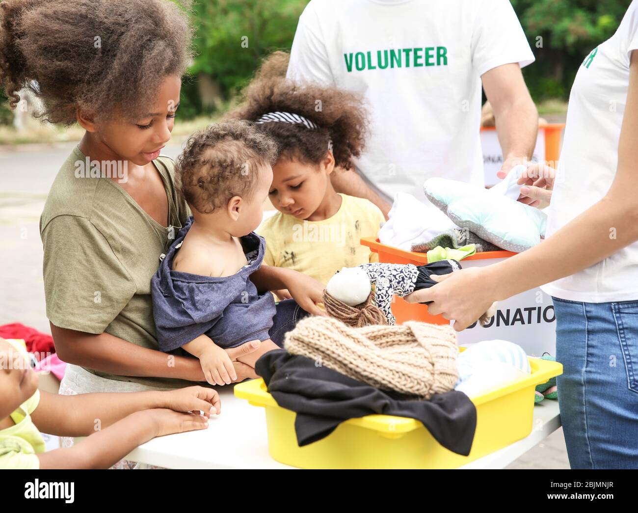 Child hands sharing toys hi-res stock photography and images - Alamy