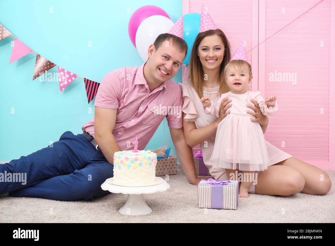 Young family celebrating first birthday of baby girl at home Stock ...
