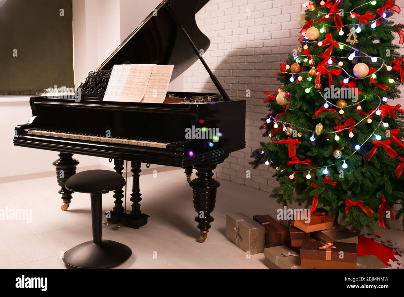 Interior of room with piano and fir tree. Christmas music concept Stock ...