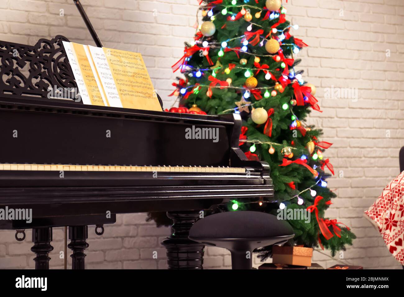Interior of room with piano and fir tree. Christmas music concept Stock ...
