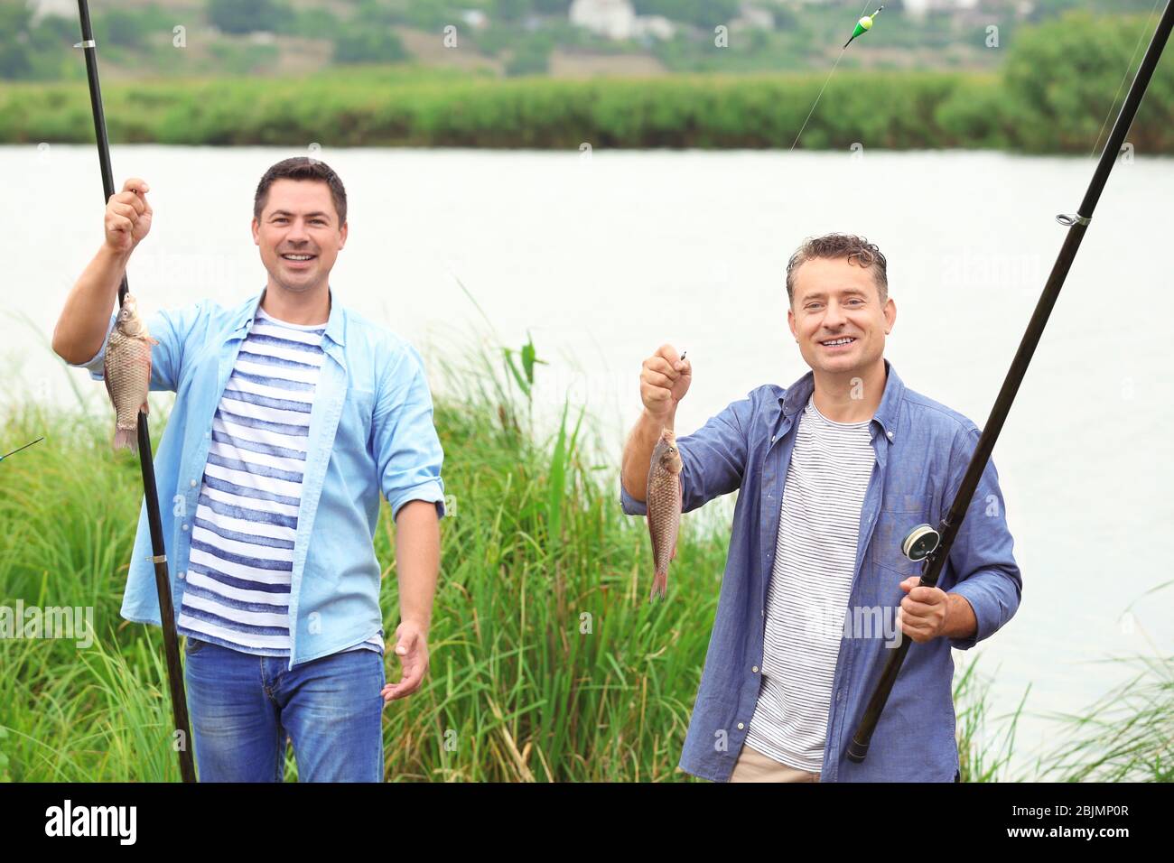 Two fish caught by fisherman hi-res stock photography and images - Alamy