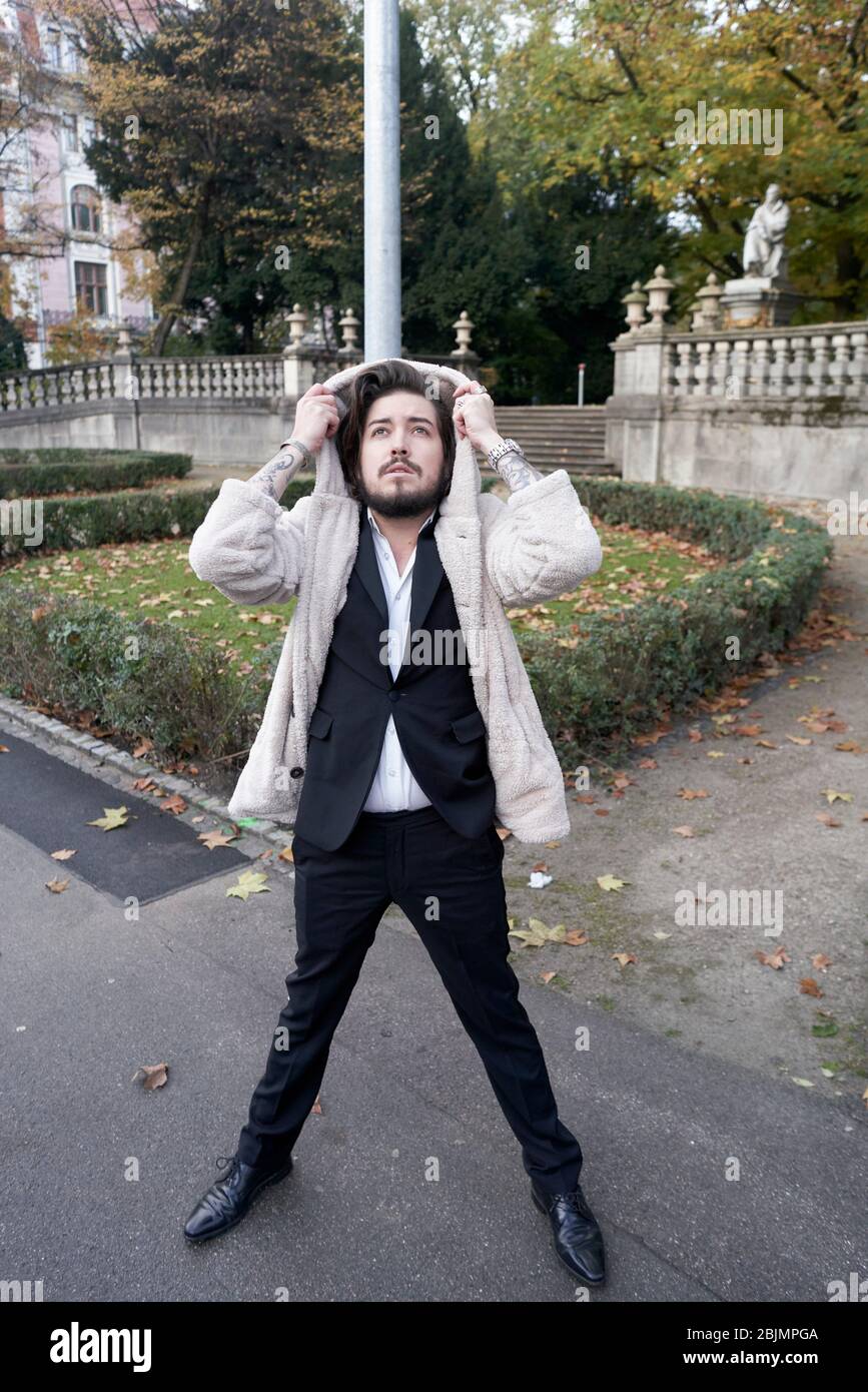 hopeful man peering up Stock Photo - Alamy