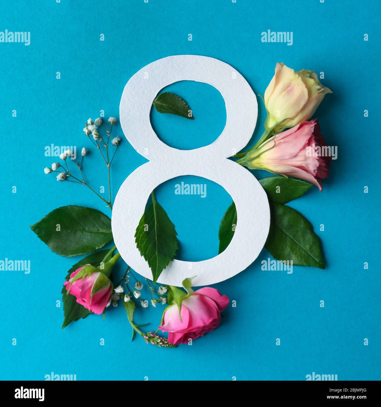 Composition with number 8 and beautiful flowers on color background ...