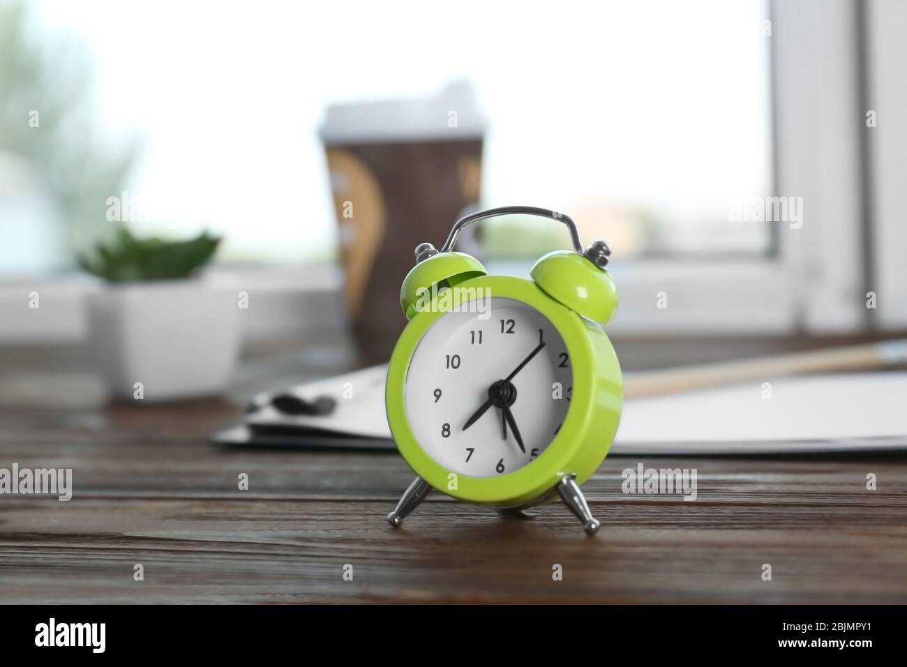 Alarm clock on wooden window sill. Morning routine concept Stock Photo ...
