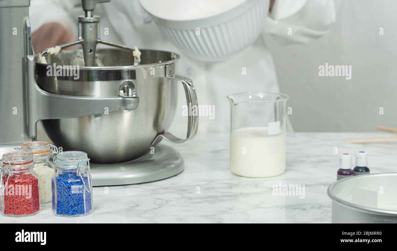 Step by step. Mixing ingredients in standing kitchen mixer to bake a ...