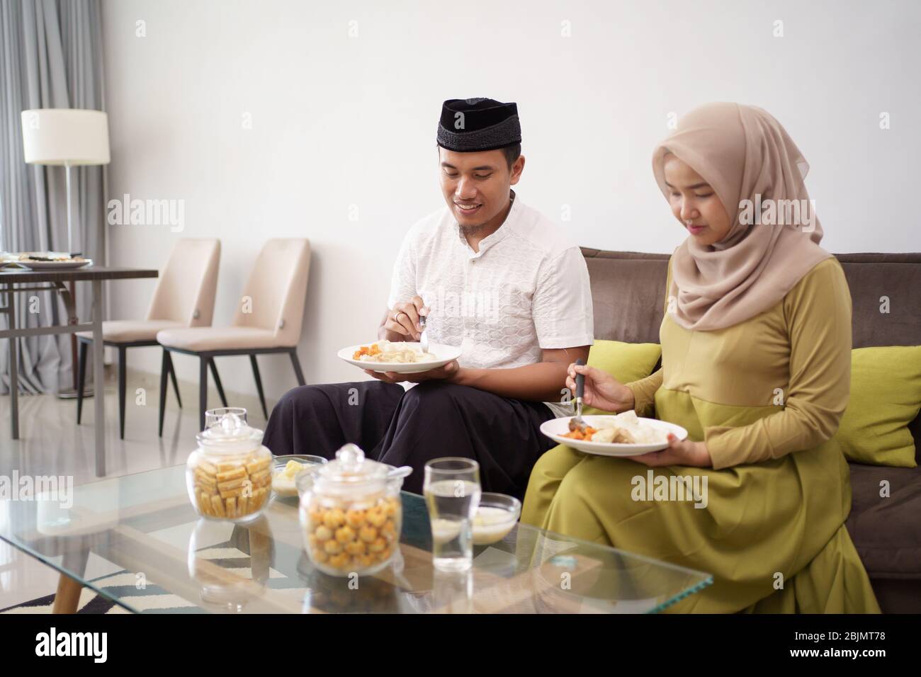 Asian couple muslim enjoying meal together breaking the fast in the ...