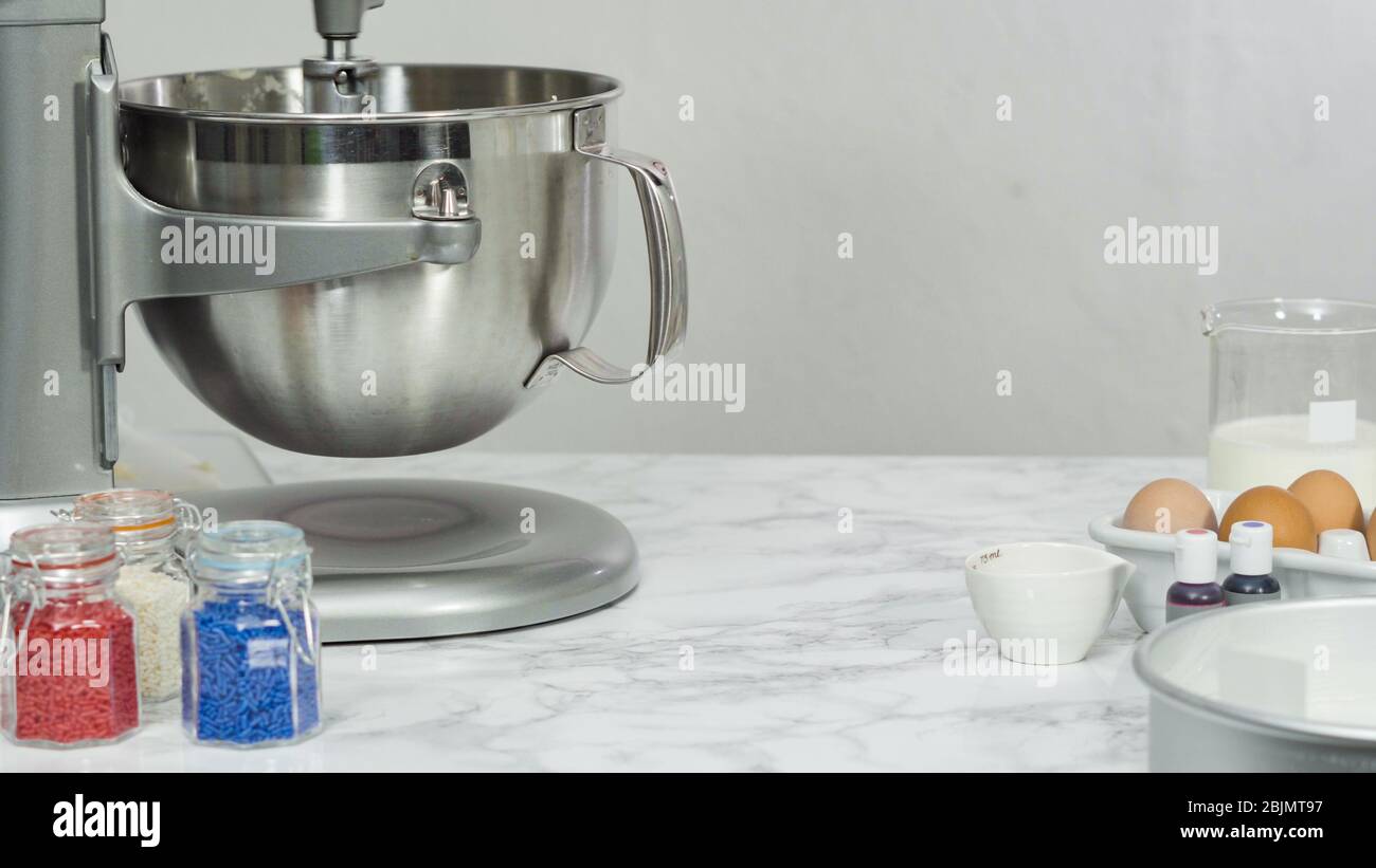 Step by step. Mixing ingredients in standing kitchen mixer to bake a ...