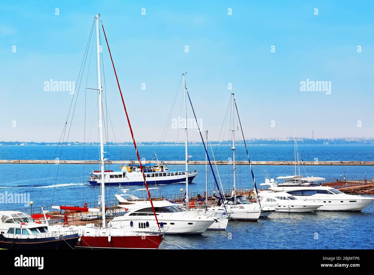 Modern yachts at sea port Stock Photo - Alamy