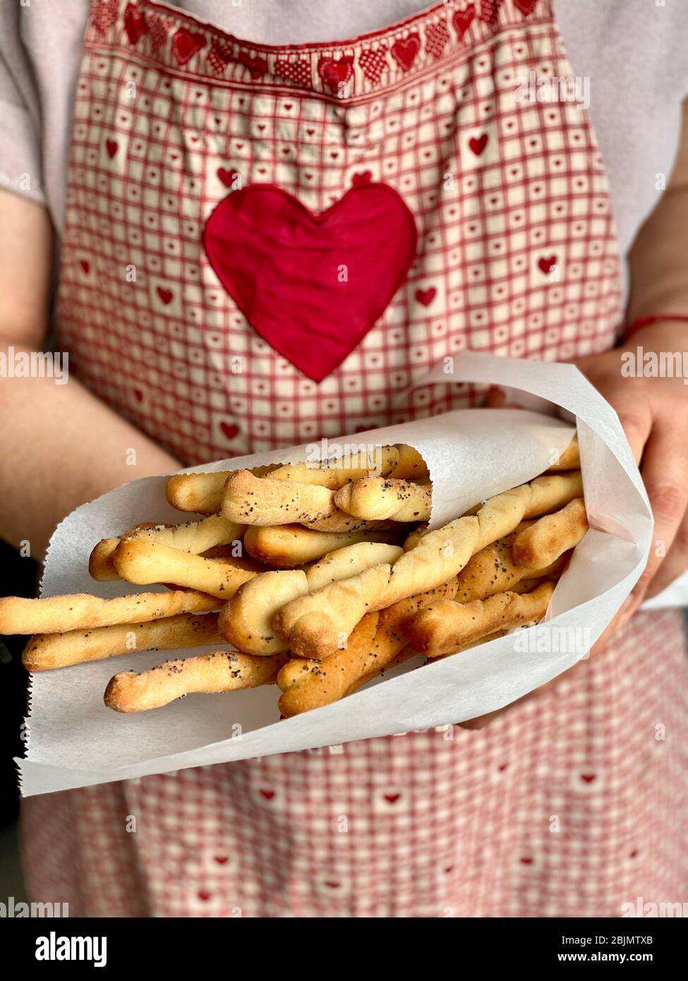 Holding bread stick hi-res stock photography and images - Alamy