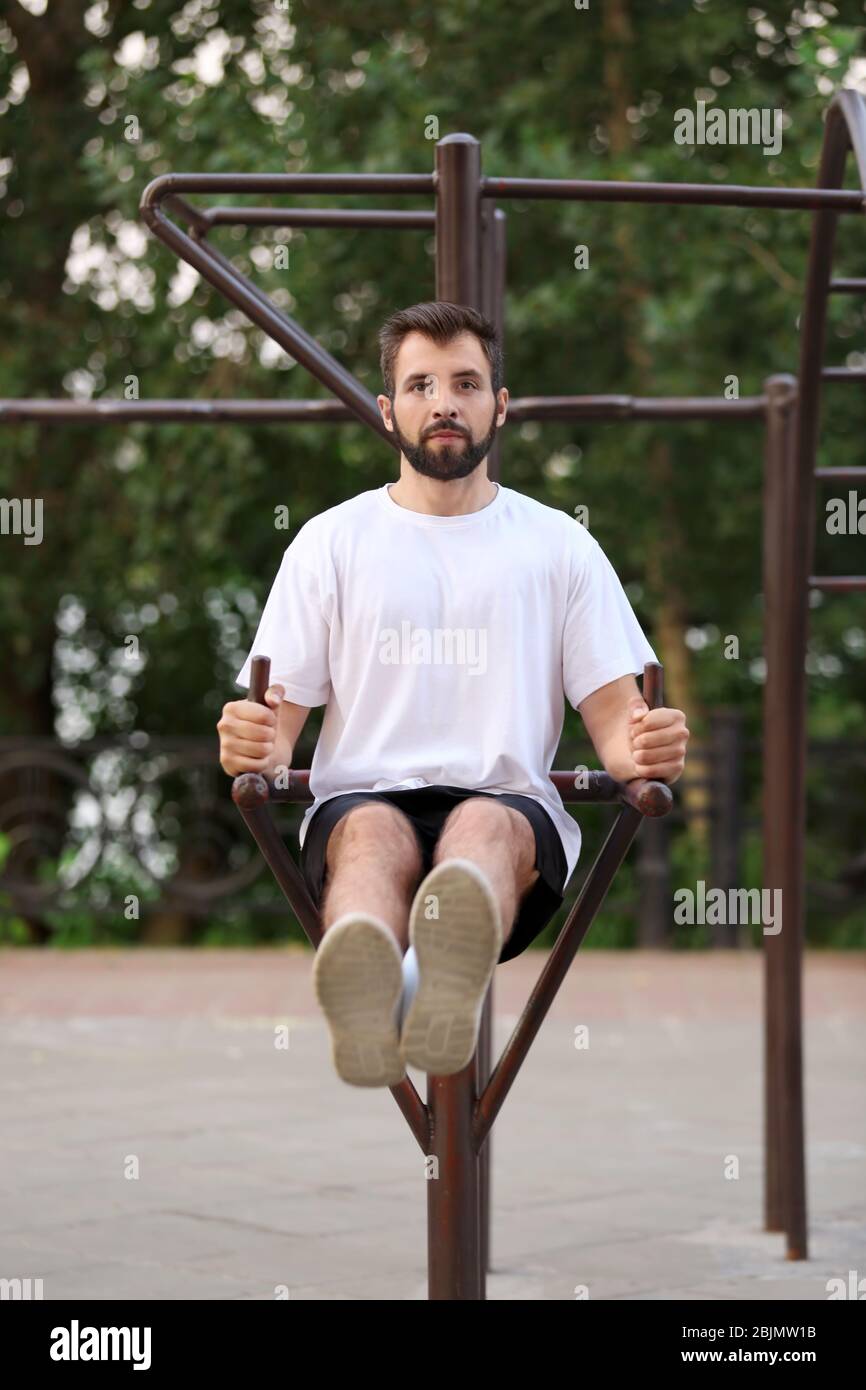 Man chin up playground hi-res stock photography and images - Alamy