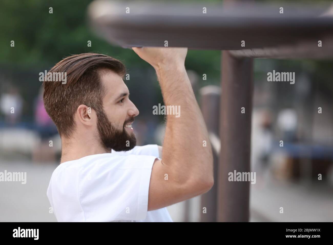 Man chin up playground hi-res stock photography and images - Alamy