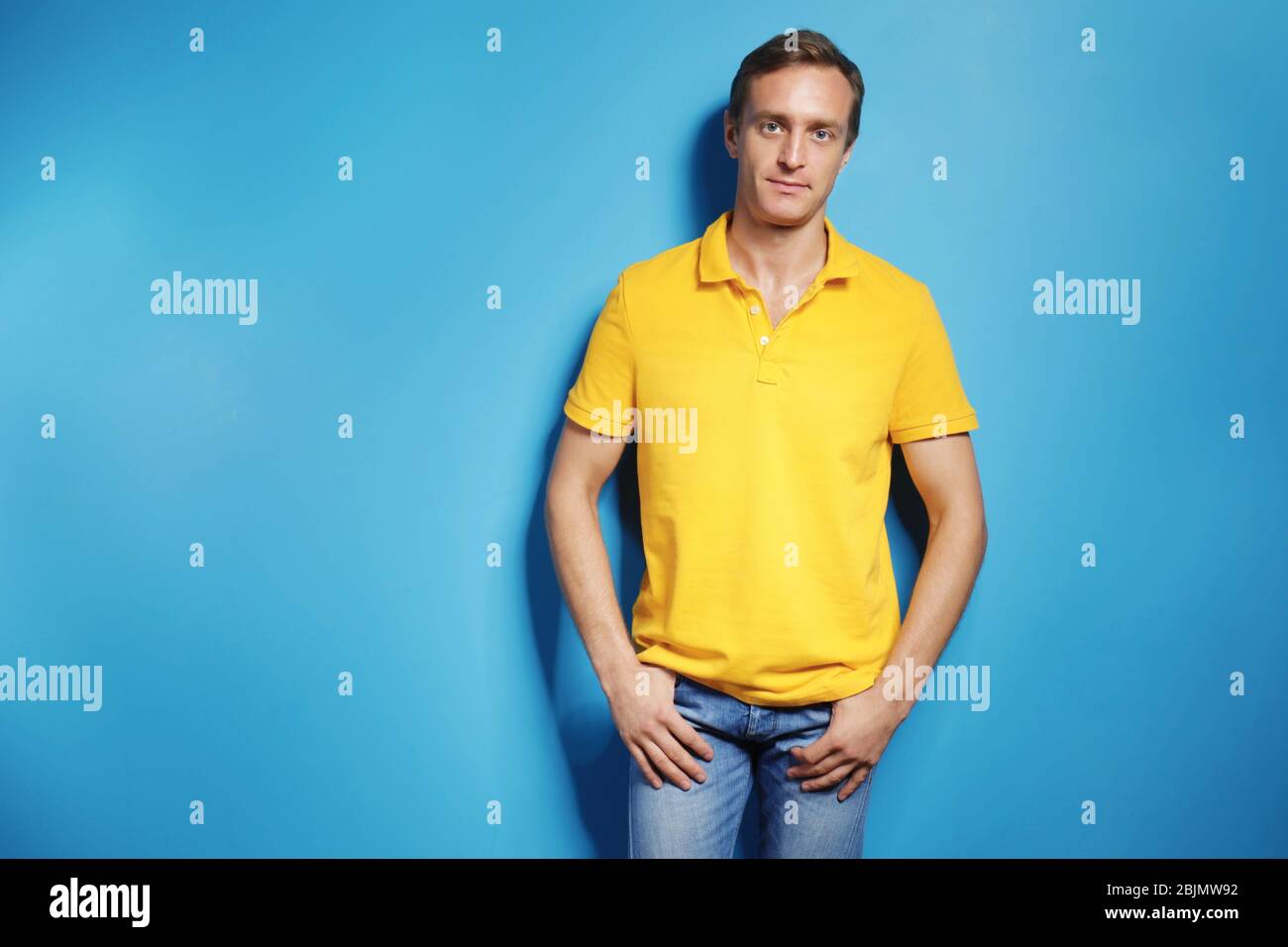 Handsome man on color background Stock Photo - Alamy