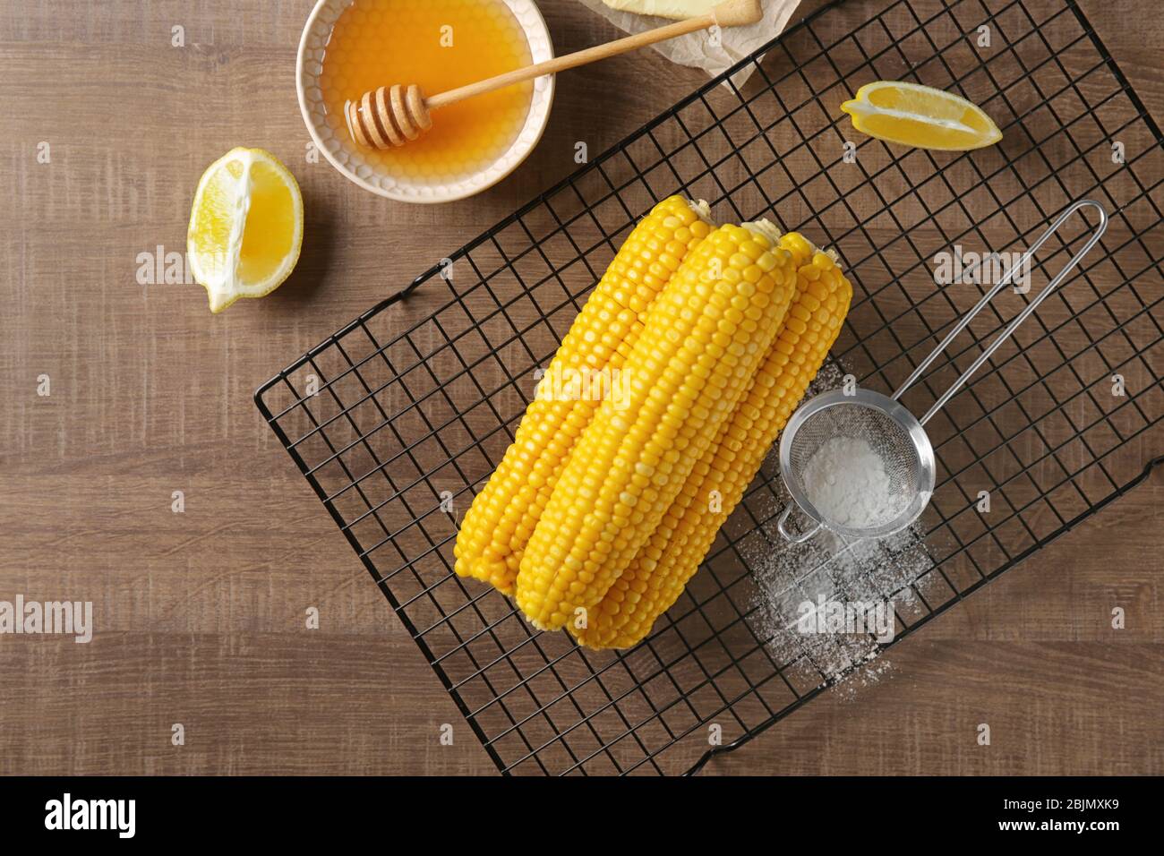 Tasty corn cobs on cooling rack Stock Photo - Alamy