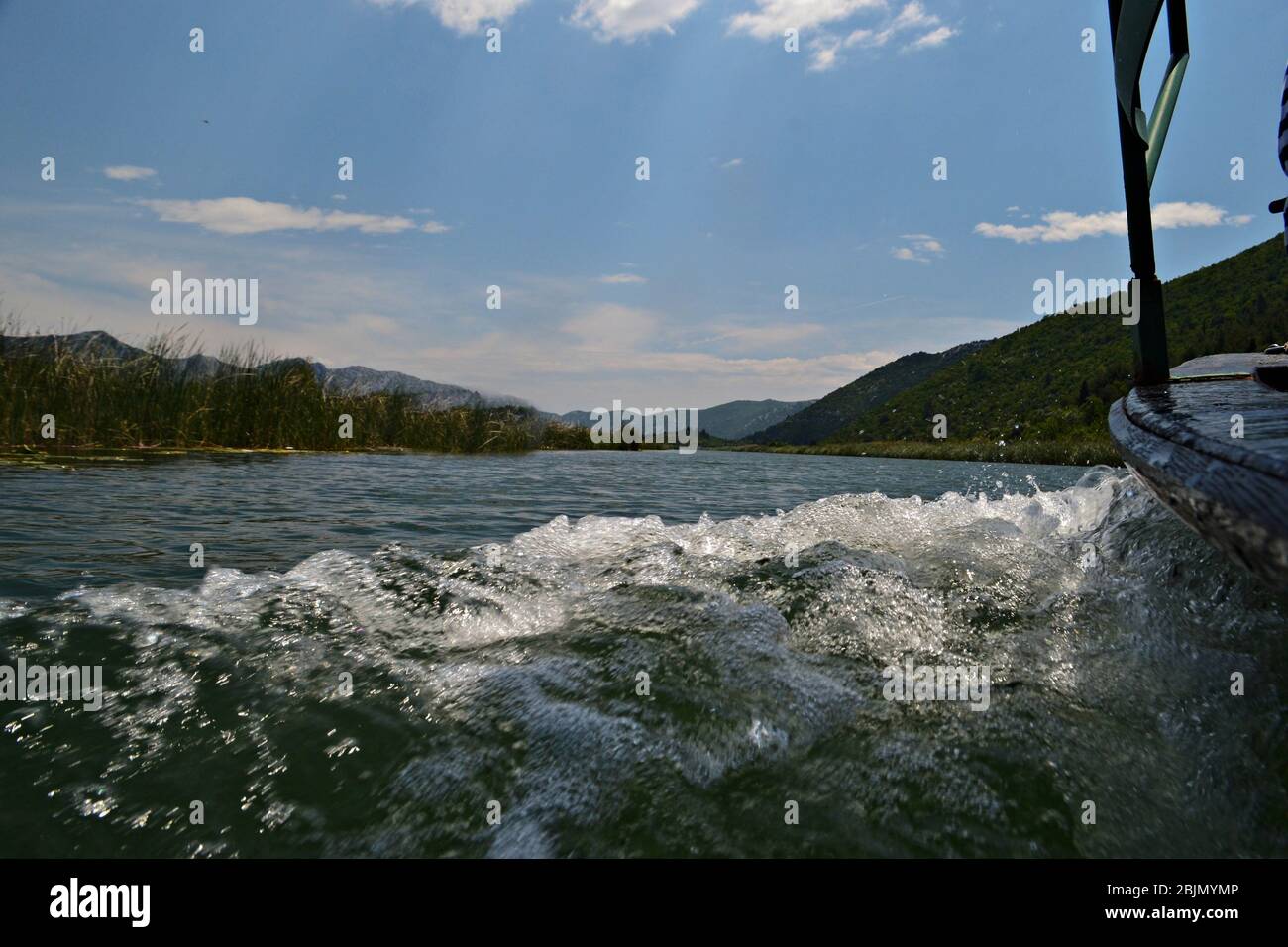 Waves on blue sea behind the speed boat water trace tails of speed boat ...