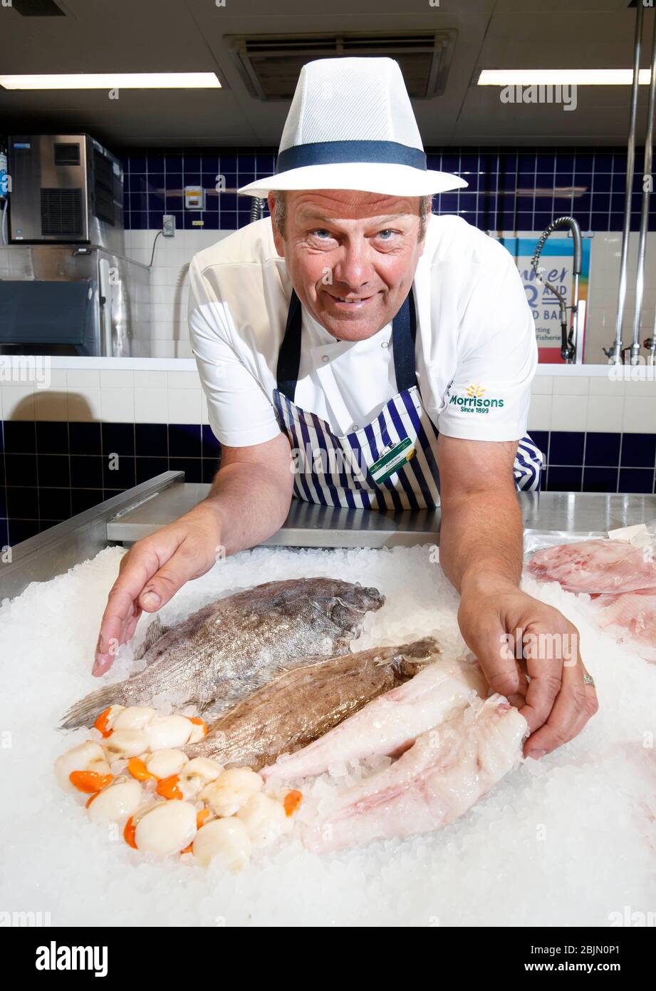 EDITORIAL USE ONLY Morrisons' Fishmonger Andrew Speight prepares whole ...