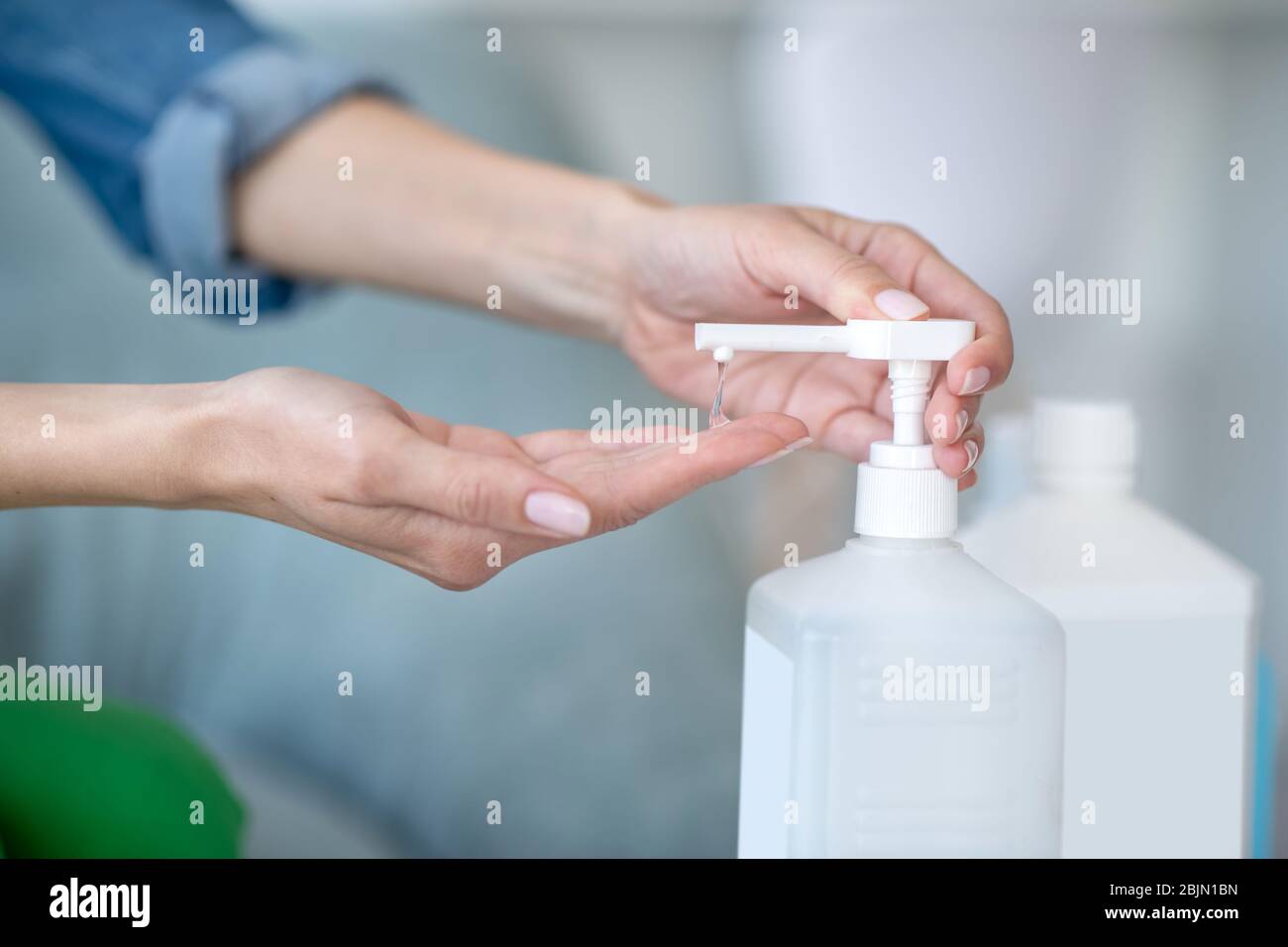 Close up picture of human hands squeezing antiseptic Stock Photo - Alamy