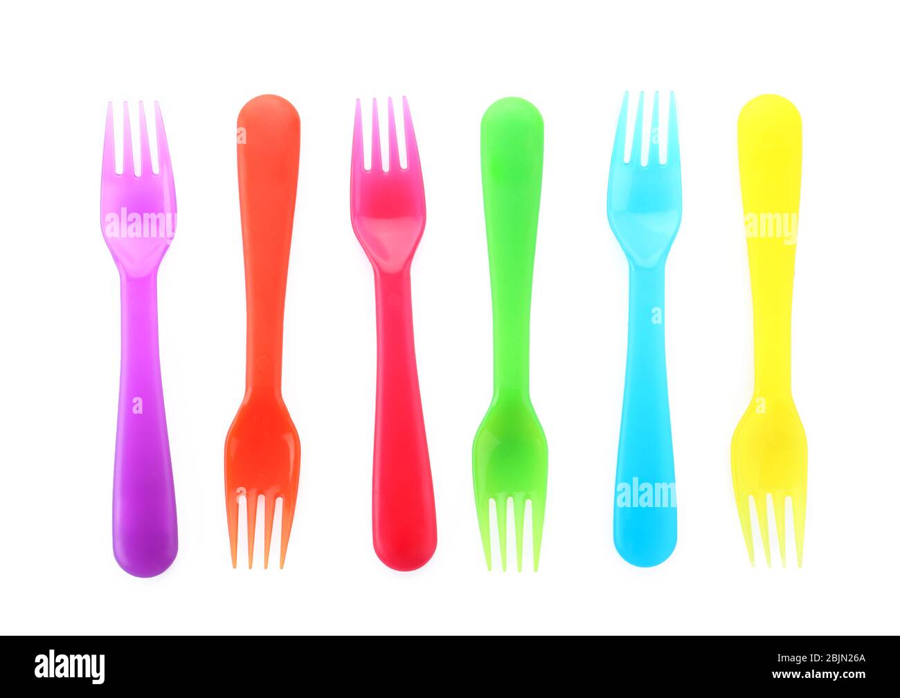 Colorful eating utensils for baby on white background Stock Photo - Alamy