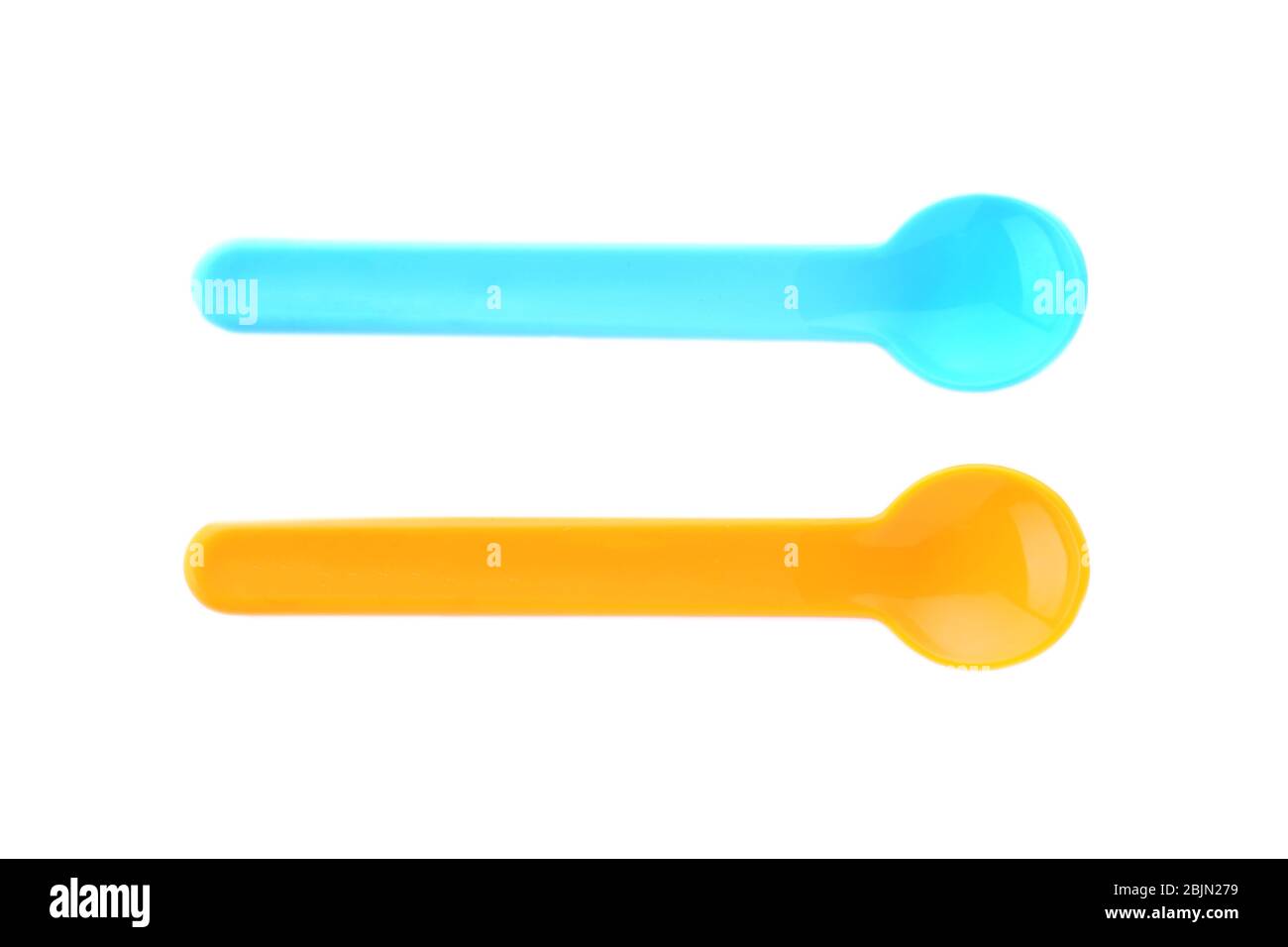 Colorful eating utensils for baby on white background Stock Photo - Alamy