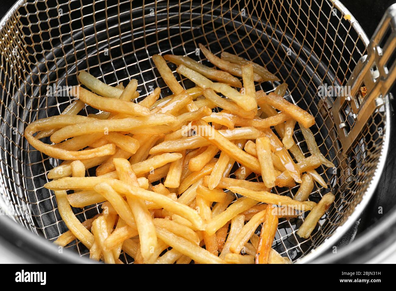 Cooking yummy french fries in chip fryer Stock Photo - Alamy
