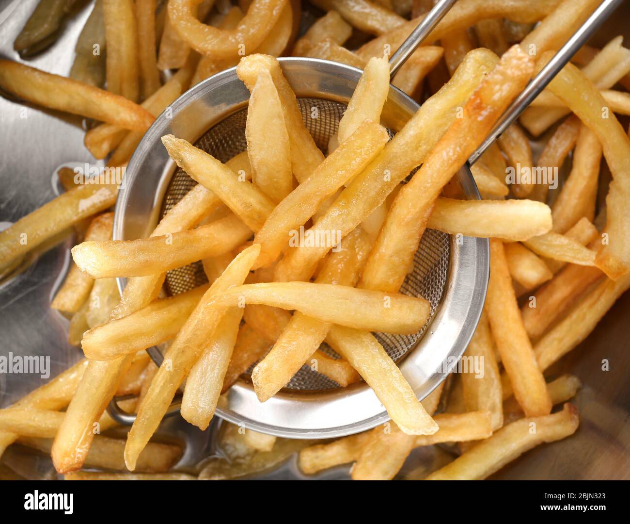 Cooking yummy french fries in chip fryer Stock Photo - Alamy