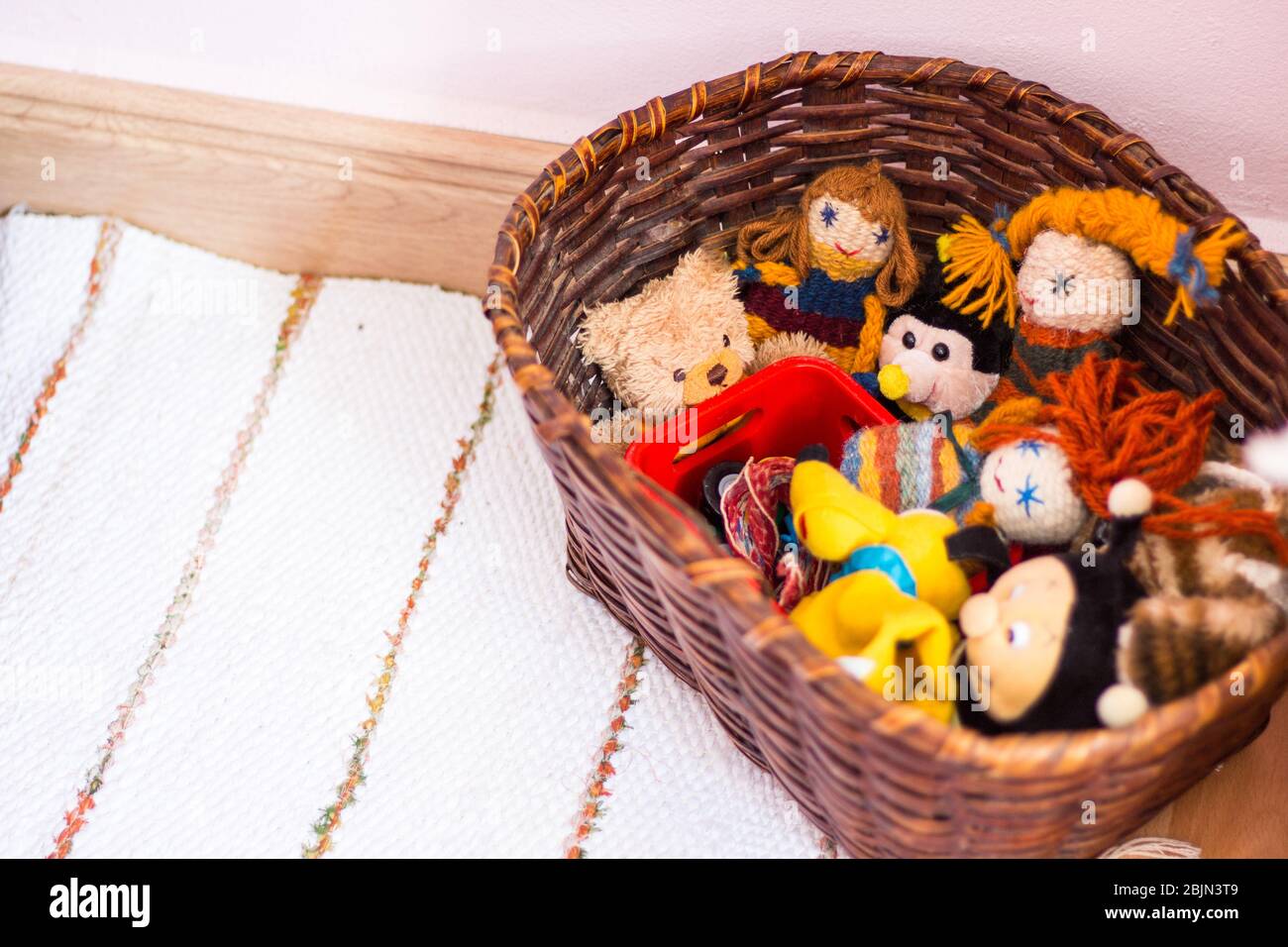 Handmade dolls and plush figures in basket on rag rug Stock Photo - Alamy