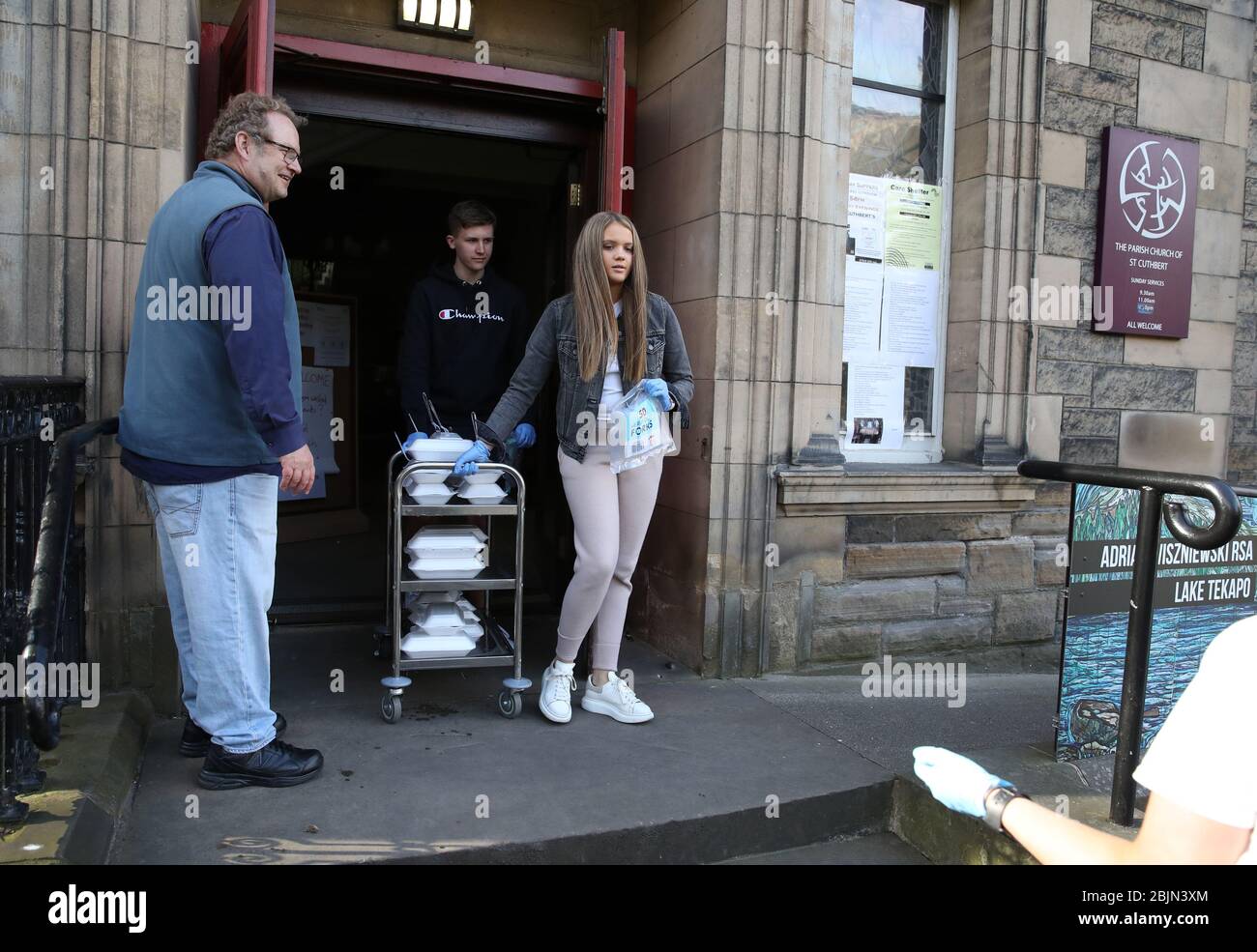 Handing out meals hi-res stock photography and images - Alamy