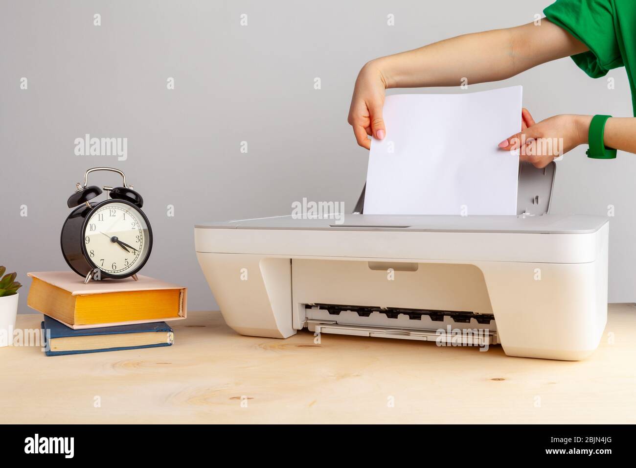 Close up of woman using a printer machine Stock Photo - Alamy
