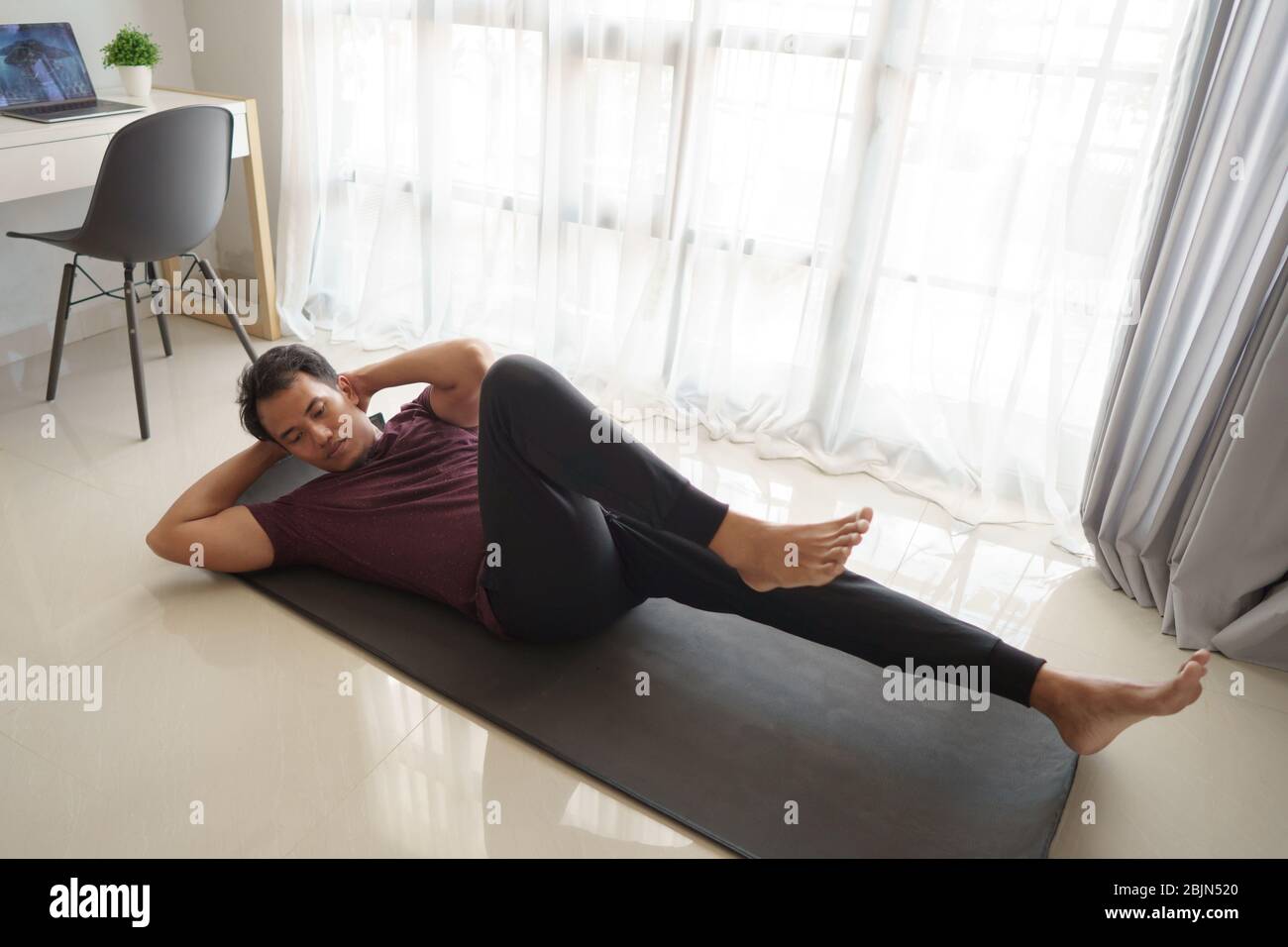 asian man sitting up workout from home in the morning Stock Photo - Alamy