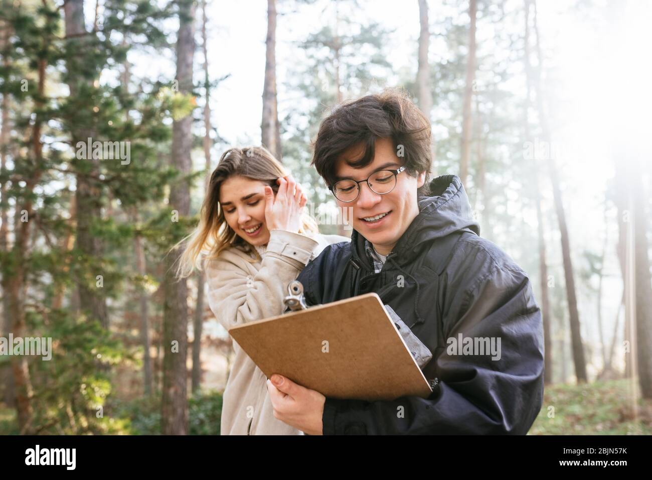 Scientists are studying plant species and inspect trees in the forest ...