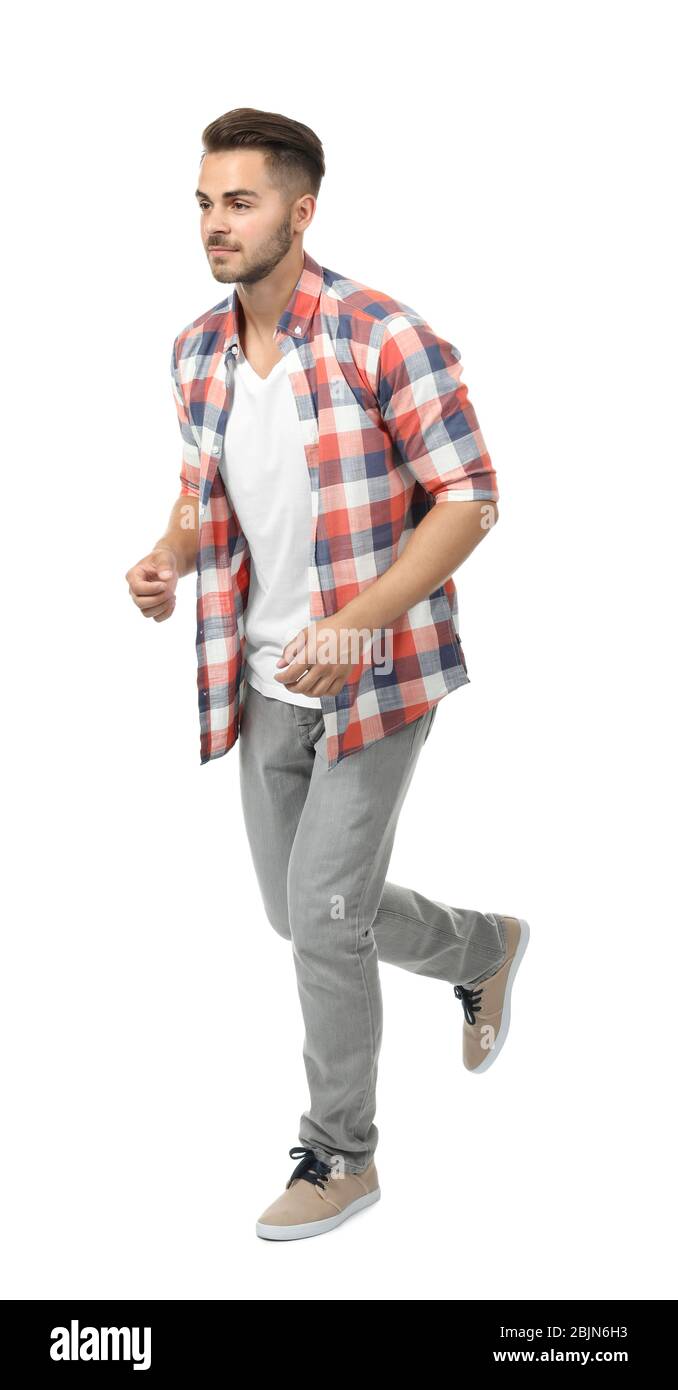 Young man in casual clothes running against white background Stock ...