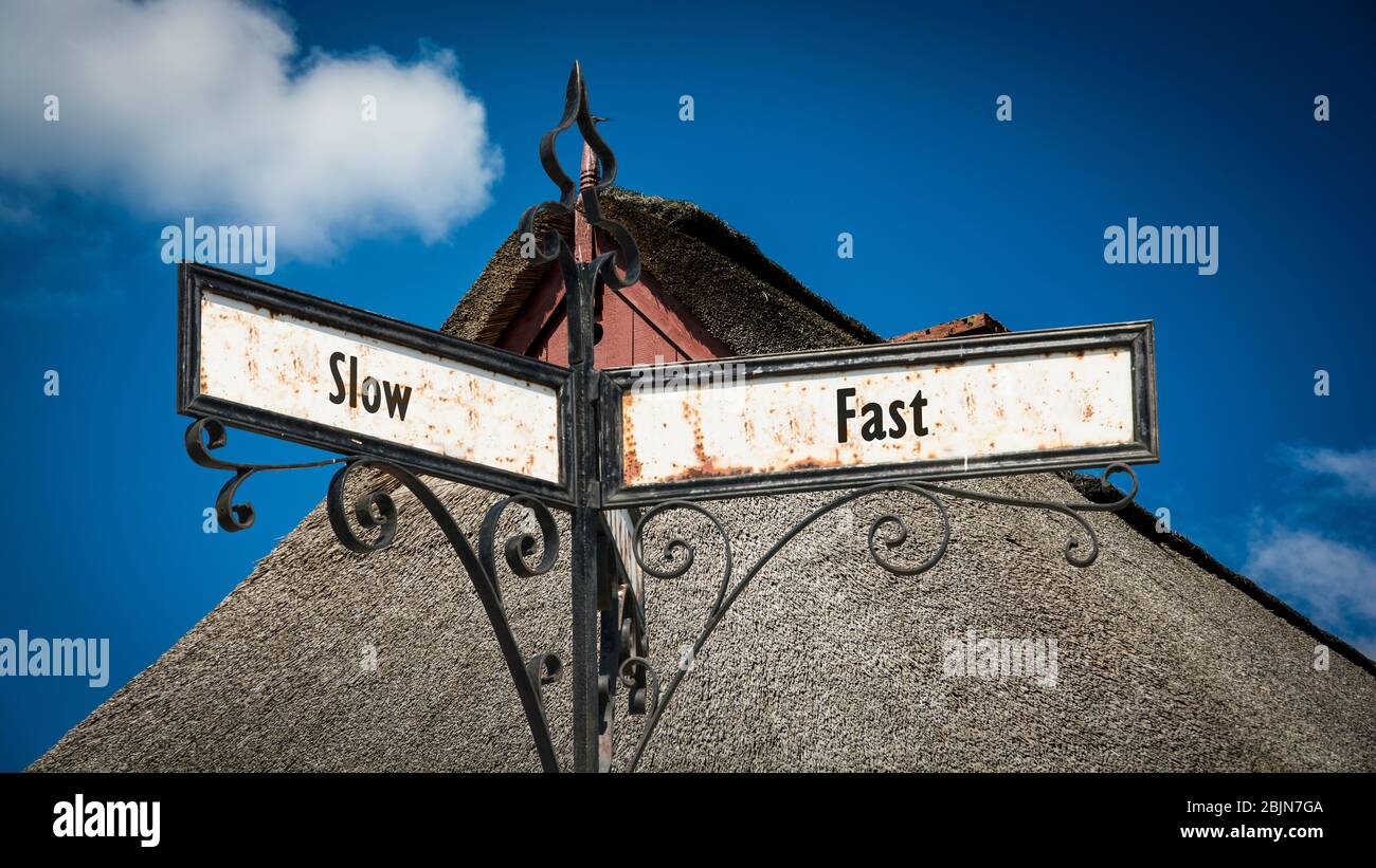 Street Sign the Direction Way to Fast versus Slow Stock Photo - Alamy