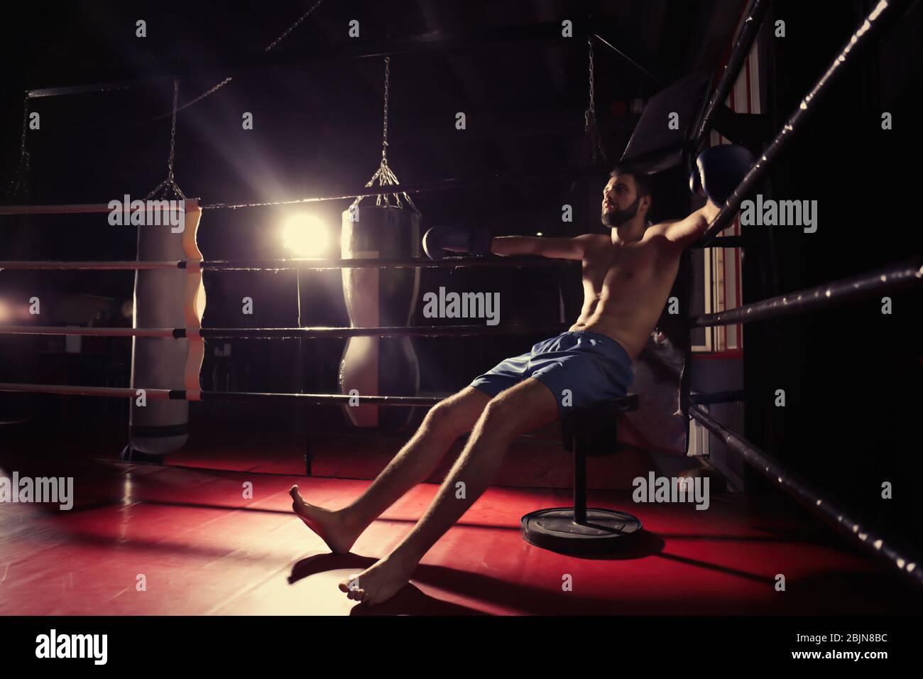 Professional boxer having break during training Stock Photo - Alamy
