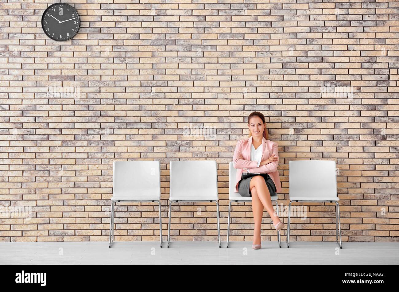 Young woman waiting for job interview in hall Stock Photo - Alamy