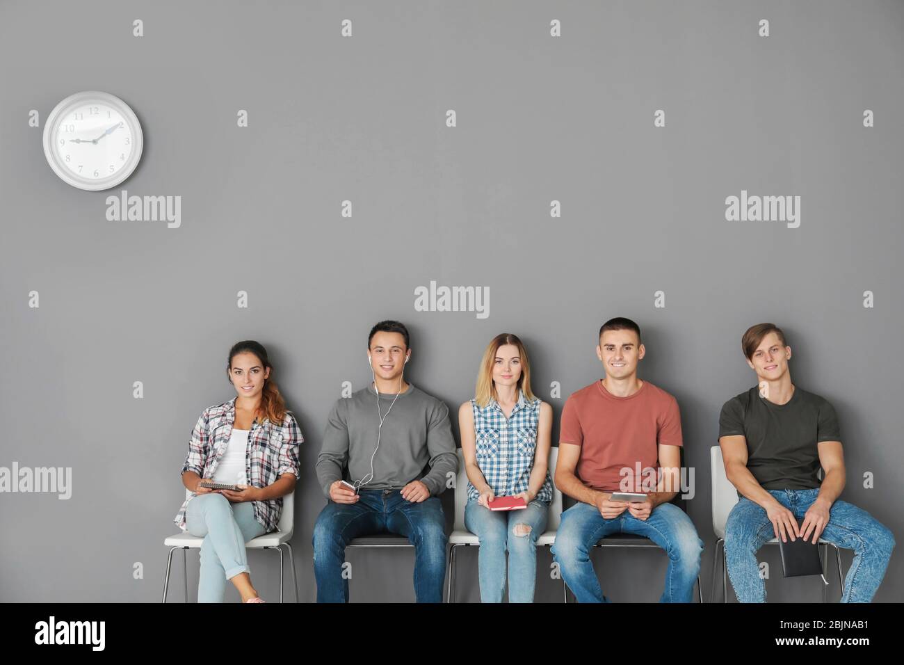 Group of people waiting for job interview on chairs Stock Photo - Alamy