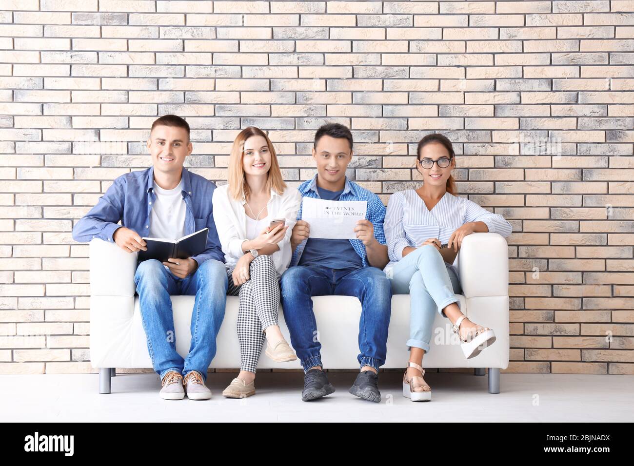 Group of people waiting for job interview on sofa Stock Photo - Alamy