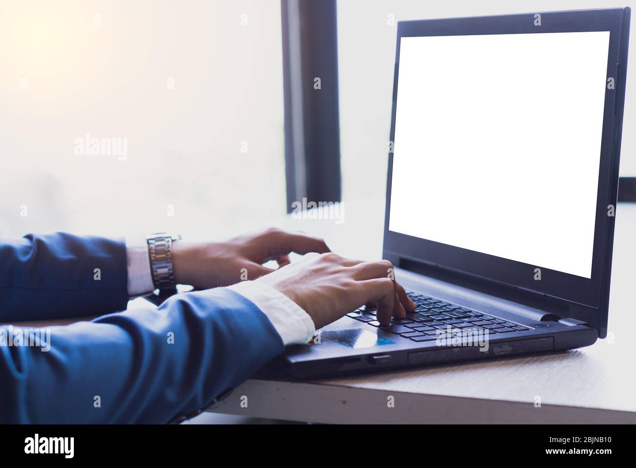 Close up business man typing keyboard with the white screen laptop ...