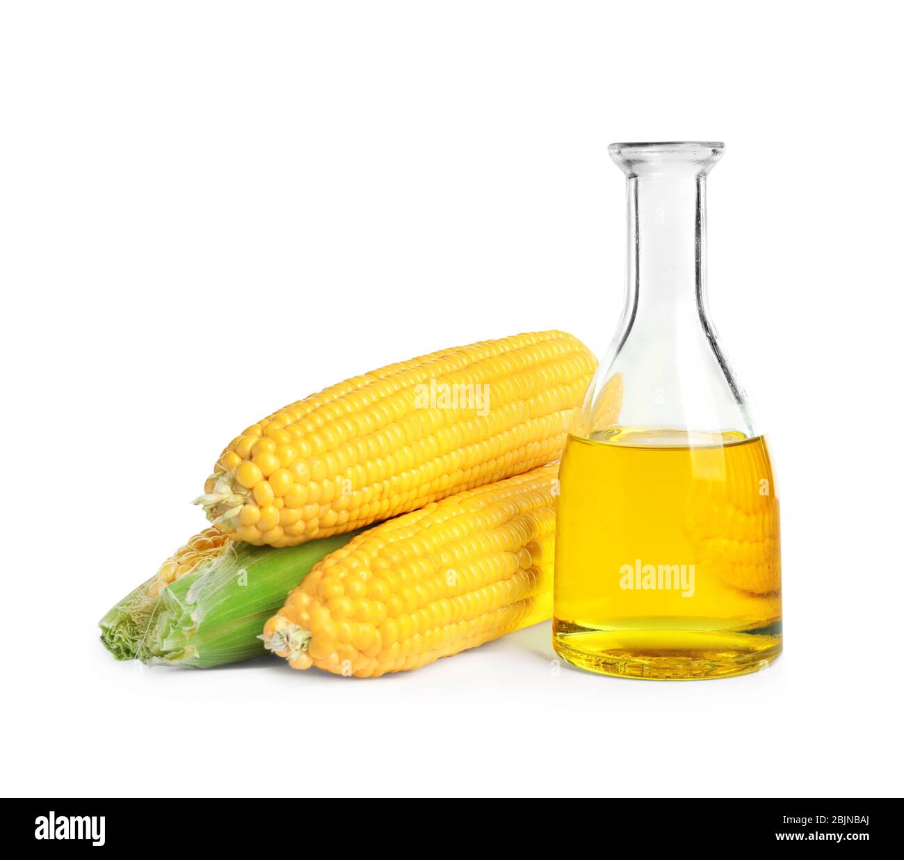 Glass bottle with corn oil and ripe cobs on white background Stock ...
