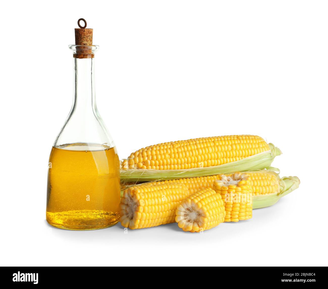 Glass bottle with corn oil and ripe cobs on white background Stock ...
