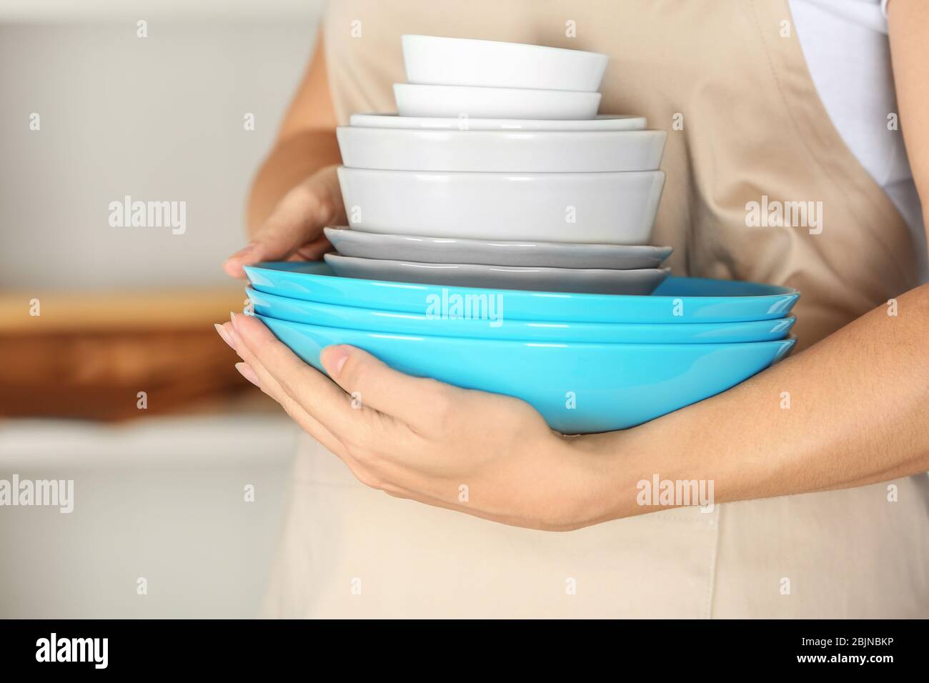 Stack of plates bowls and utensils hi-res stock photography and images ...