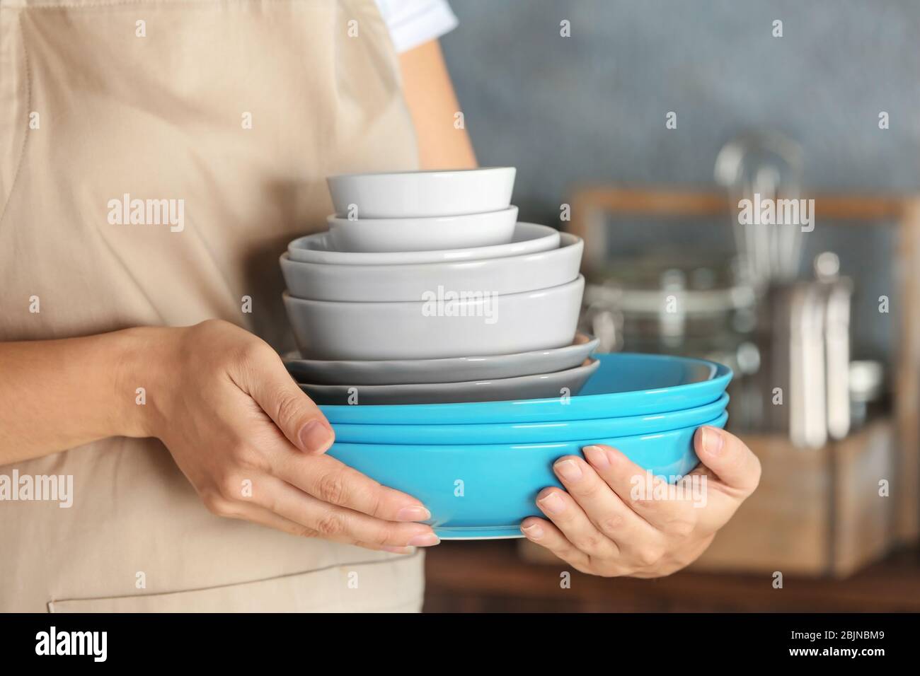 Stack of plates bowls and utensils hi-res stock photography and images ...