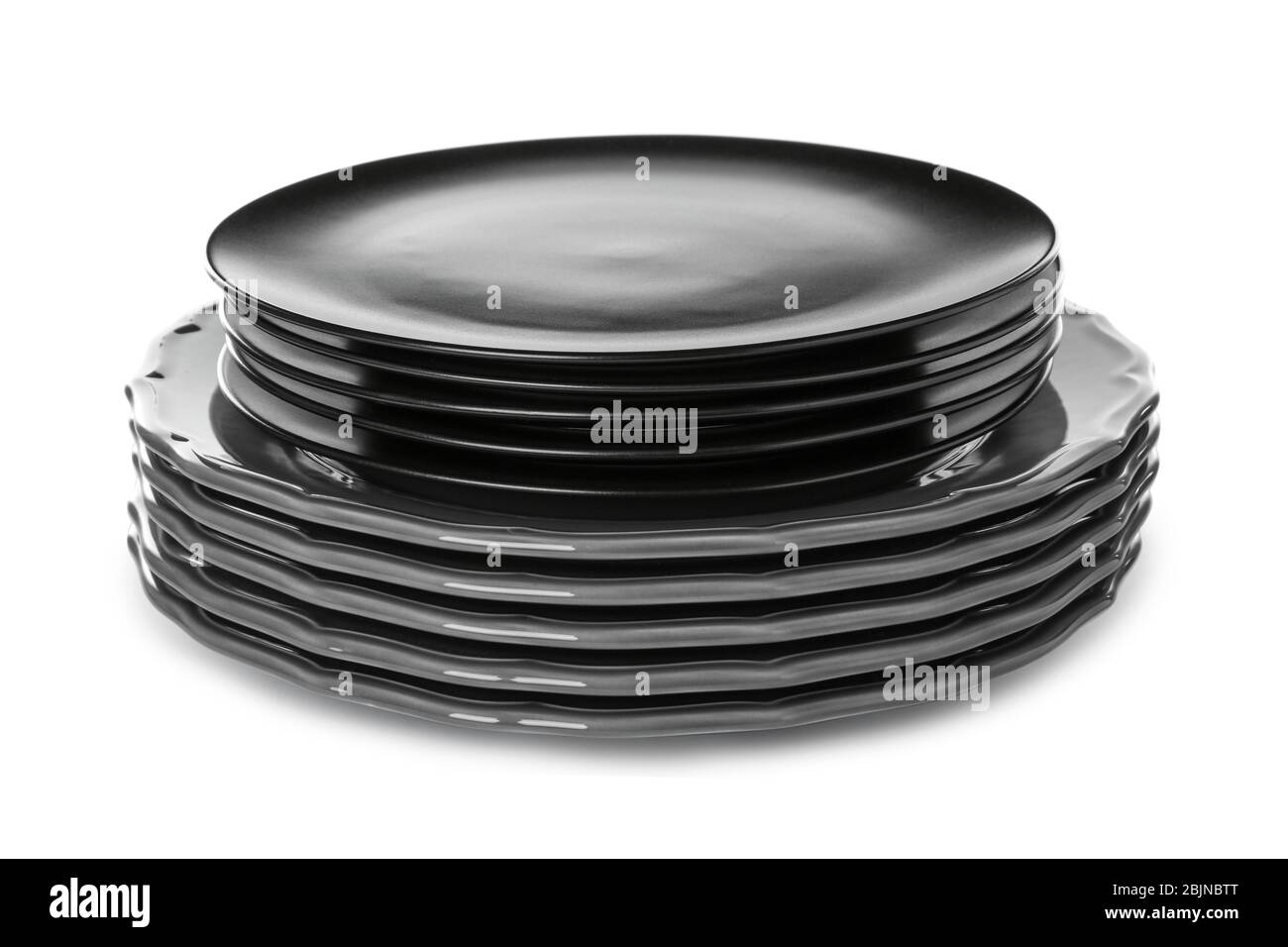 Stack of plates on white background Stock Photo - Alamy