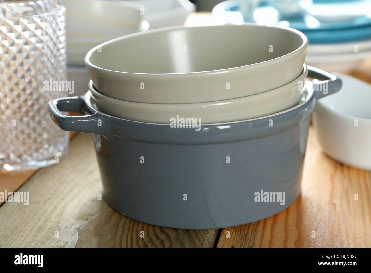 Stack of dishes on table Stock Photo - Alamy