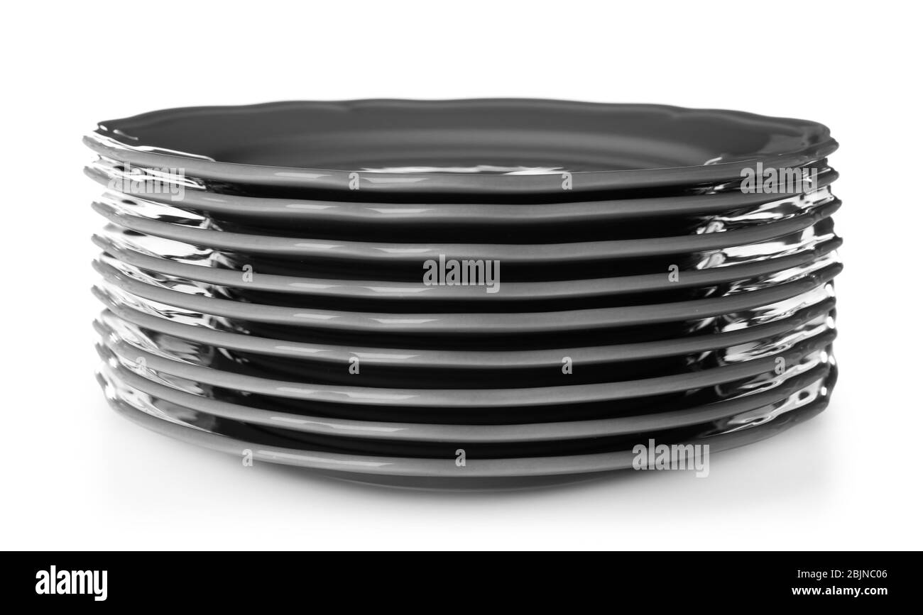 Stack of plates on white background Stock Photo - Alamy