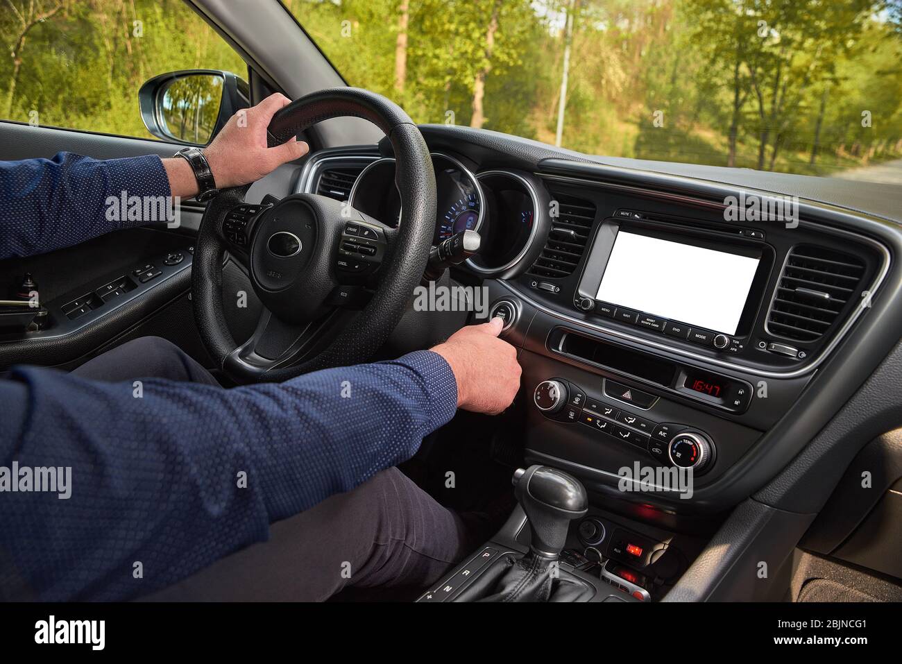 Car driver starting the engine Start, stop engine button Stock Photo ...