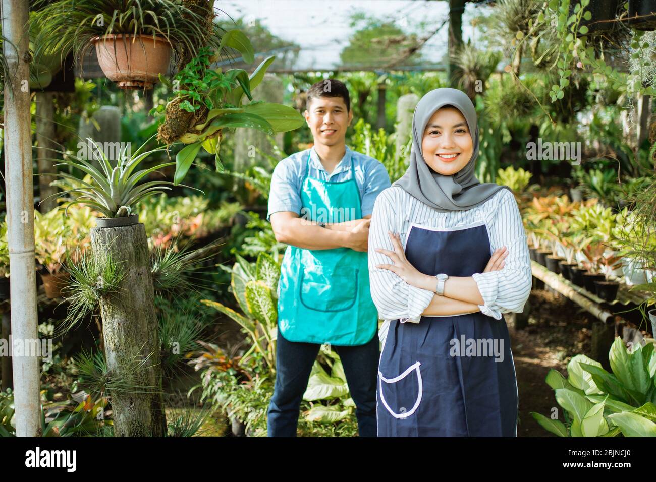 happy gardener team working in the garden. botanical concept Stock ...